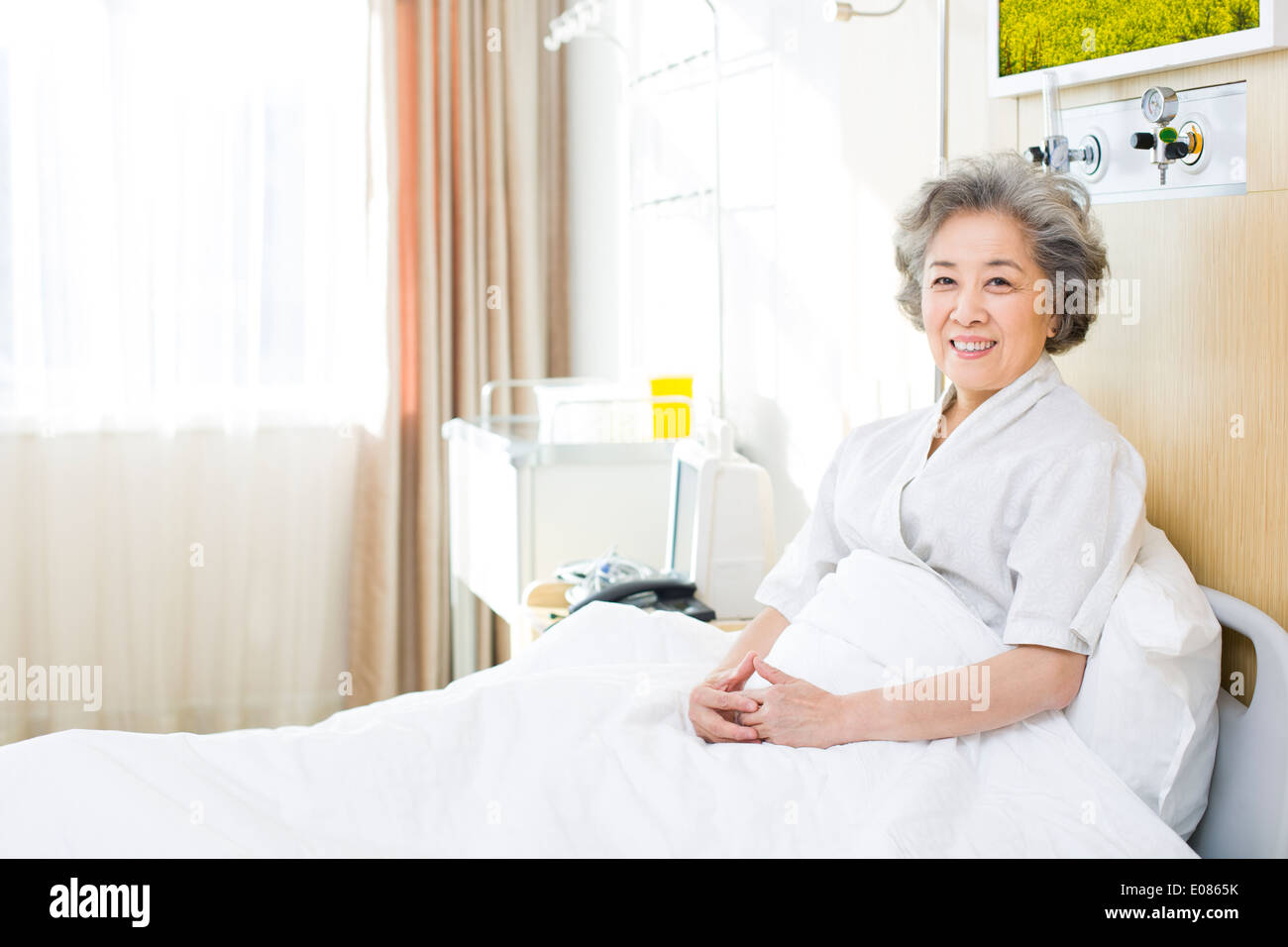 Senior woman recovering in hospital Stock Photo - Alamy