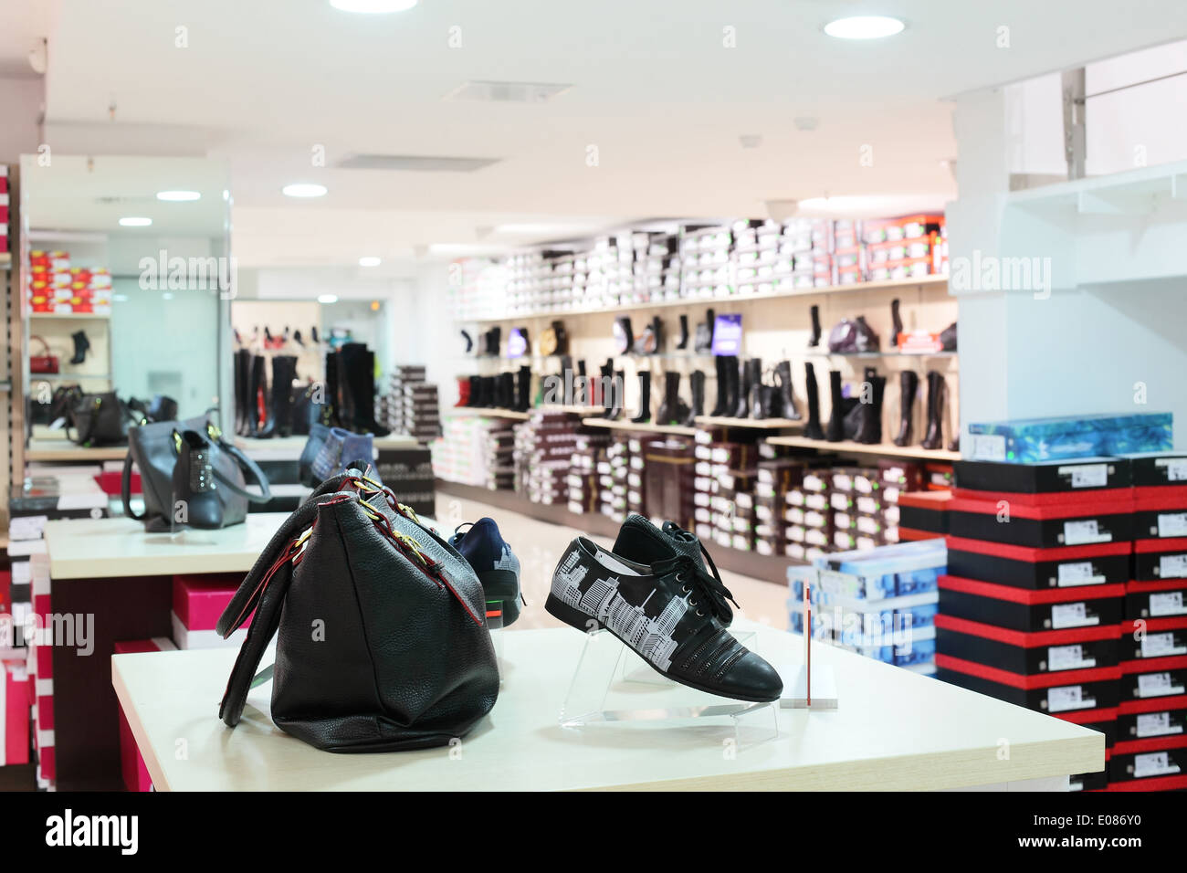bright and fashionable interior of shoe store in modern mall Stock ...
