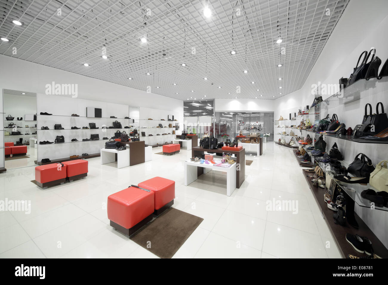 bright and fashionable interior of shoe store in modern mall Stock ...
