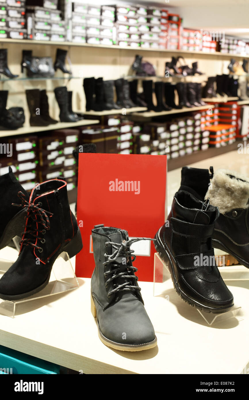 bright and fashionable interior of shoe store in modern mall Stock ...