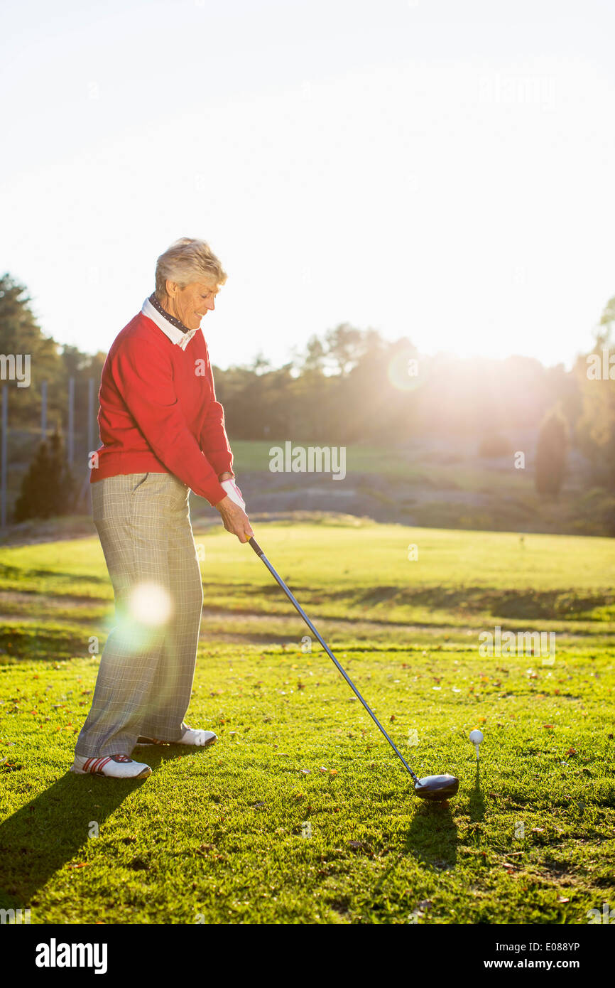 Side view woman playing golf hi-res stock photography and images - Alamy