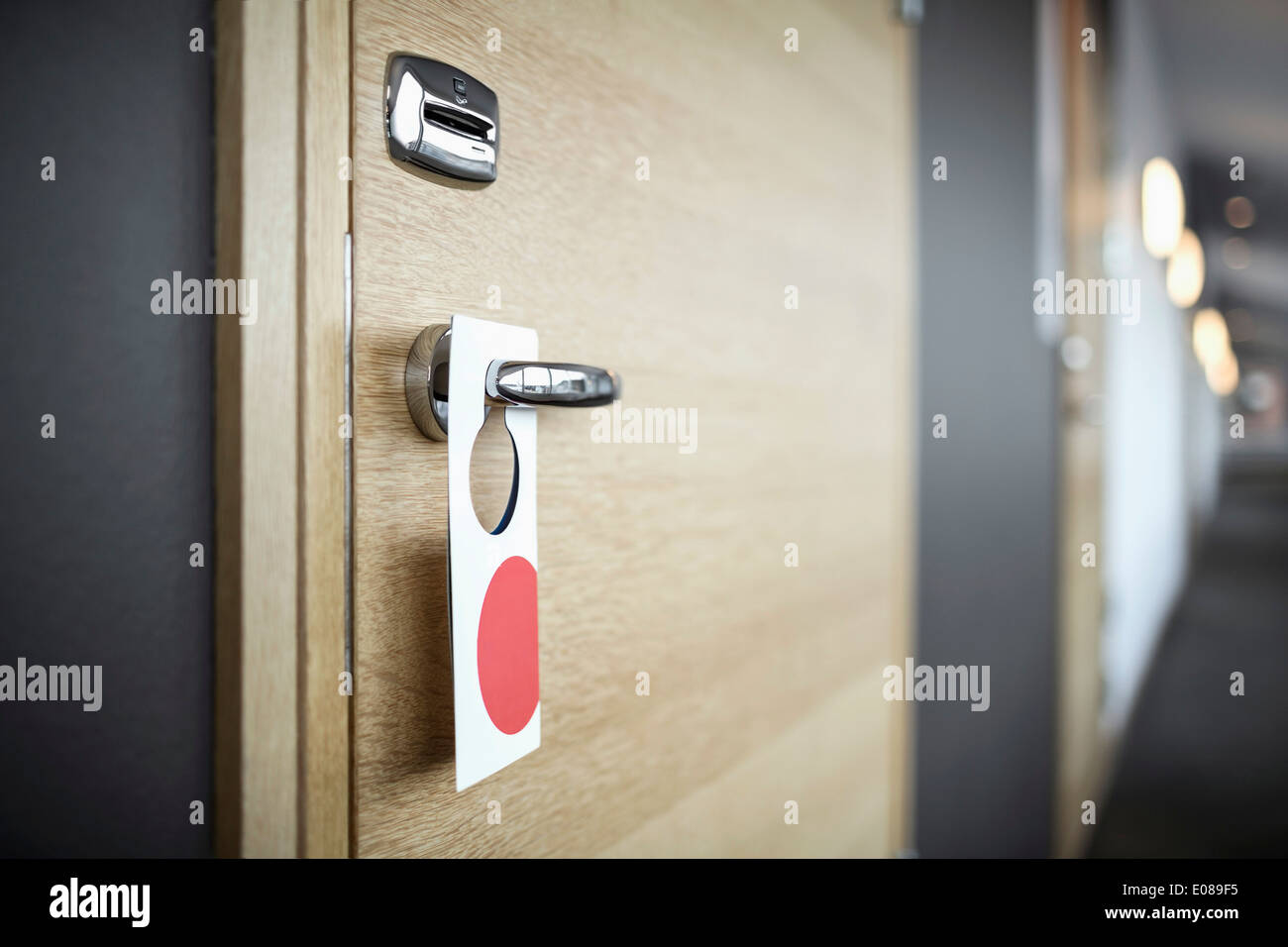 Label hanging on hotel door handle Stock Photo - Alamy