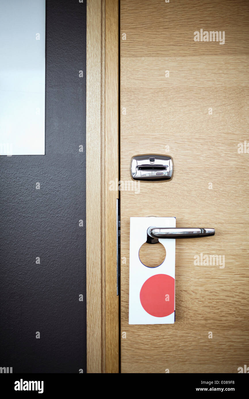 Label hanging on door handle in hotel Stock Photo - Alamy