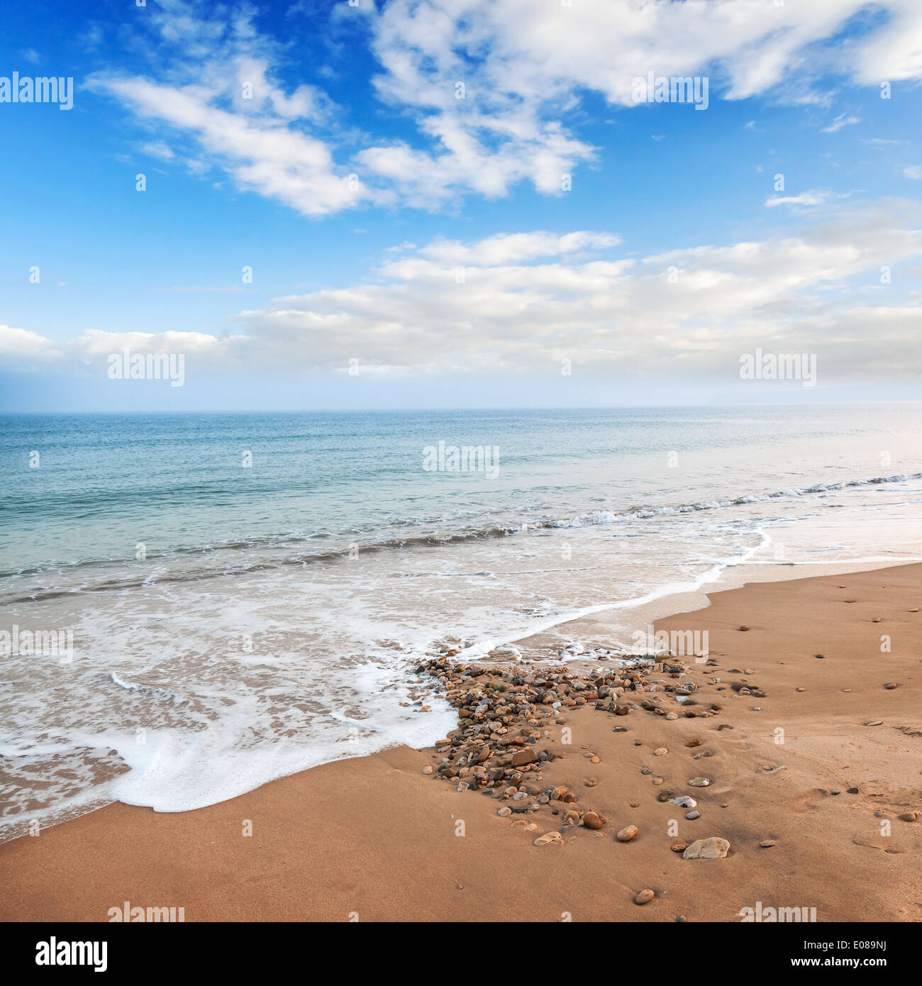 Atlantic ocean coast with bright cloudy sky Stock Photo - Alamy