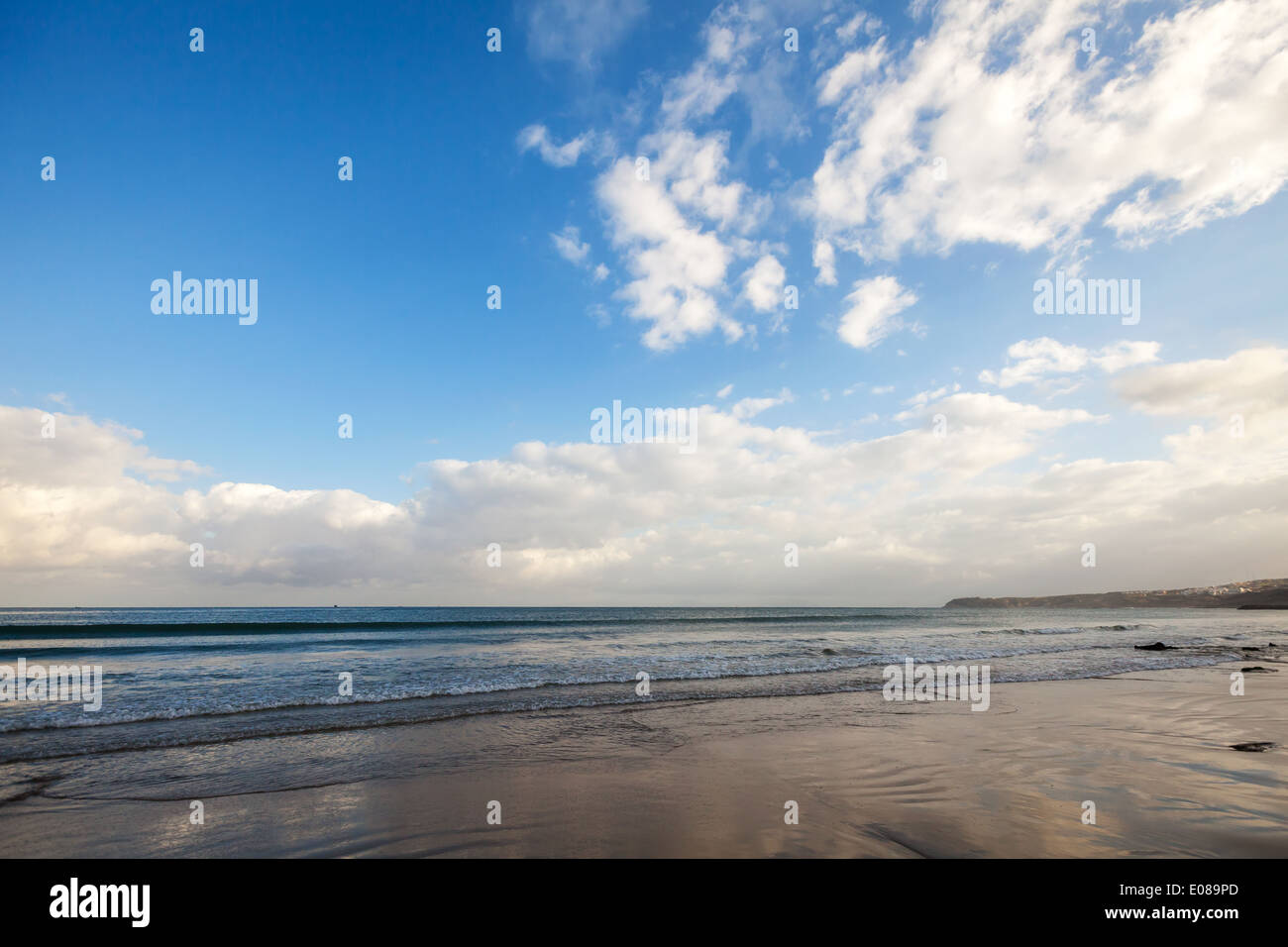 Atlantic ocean coast with bright blue cloudy sky Stock Photo - Alamy