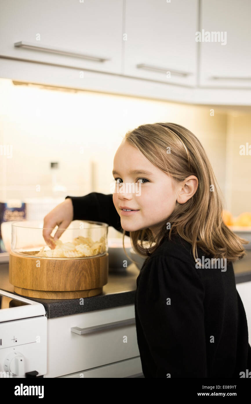 Girl eating potato chips crisps hi-res stock photography and images - Alamy