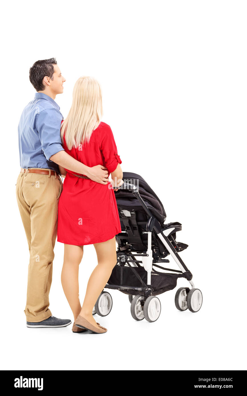Young parents pushing a baby stroller Stock Photo - Alamy