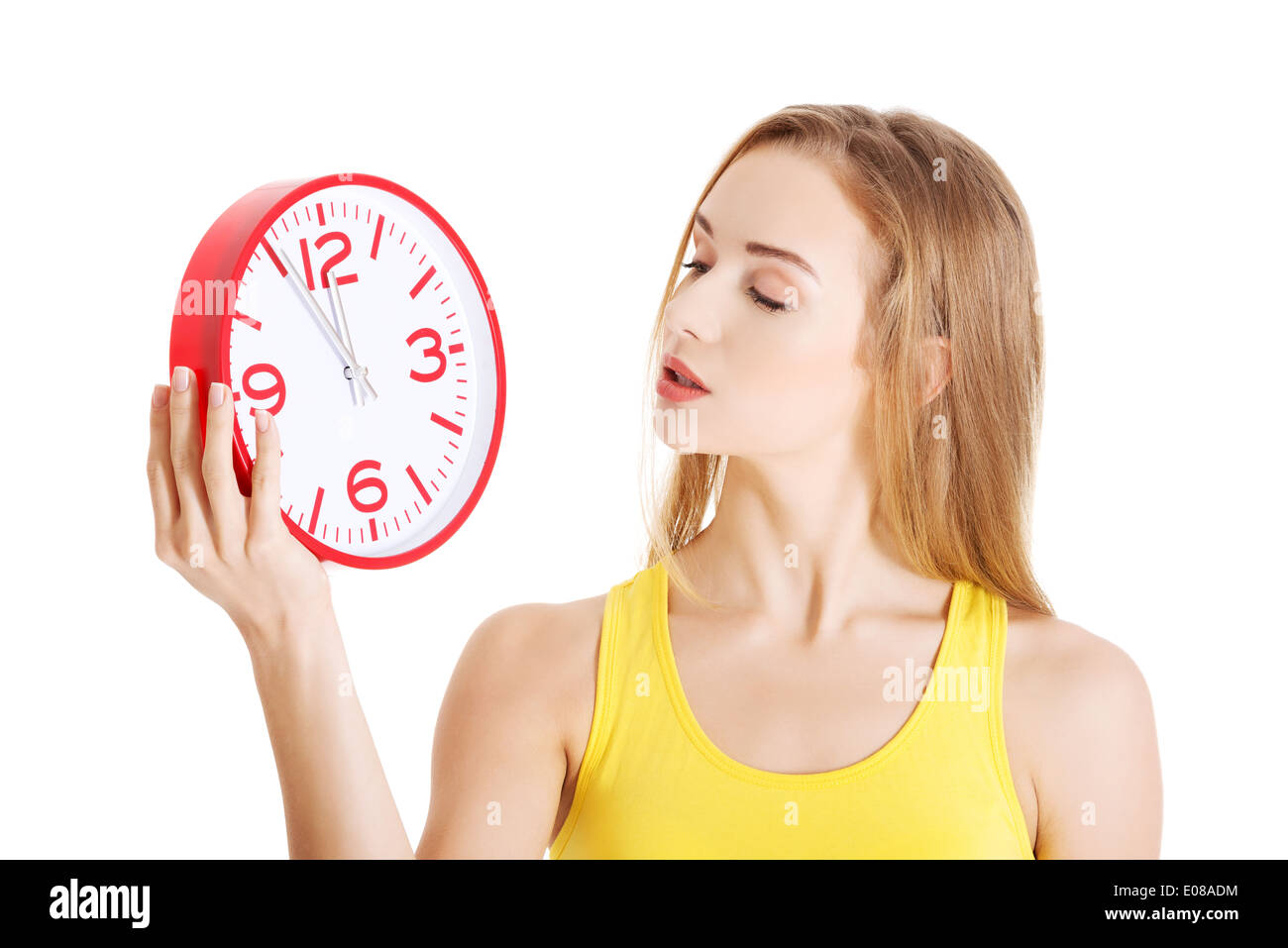 Happy woman holding office clock Stock Photo - Alamy