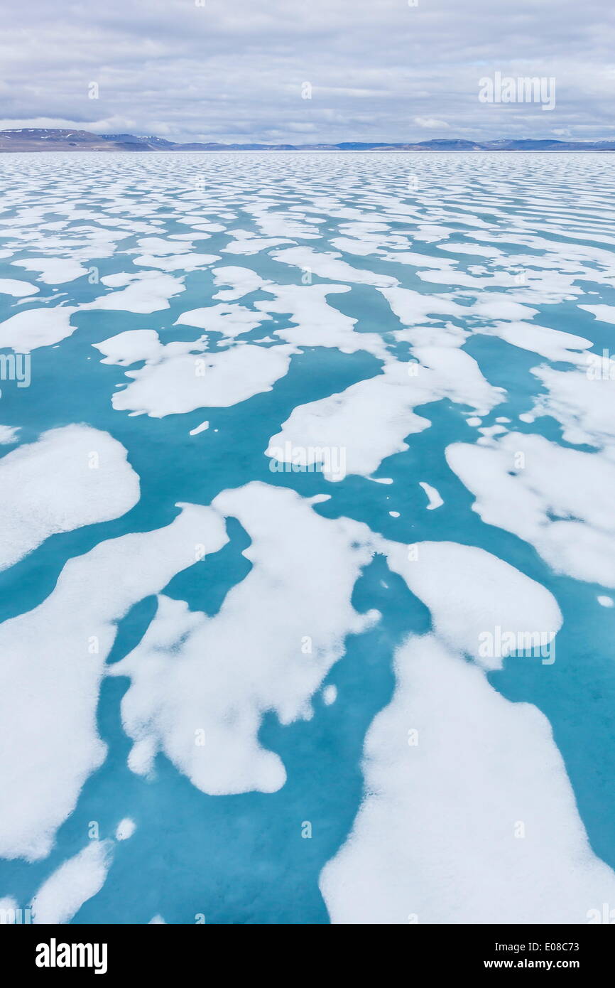 Shorefast ice starting to melt in Maxwell Bay, Devon Island, Nunavut ...