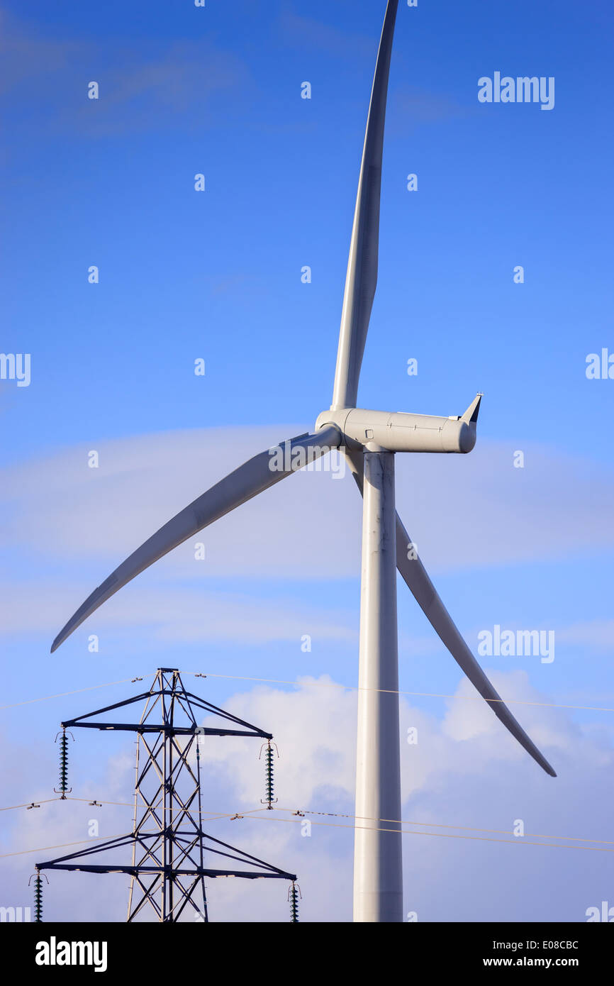 Wind Turbine and Electricity Pylon Stock Photo - Alamy