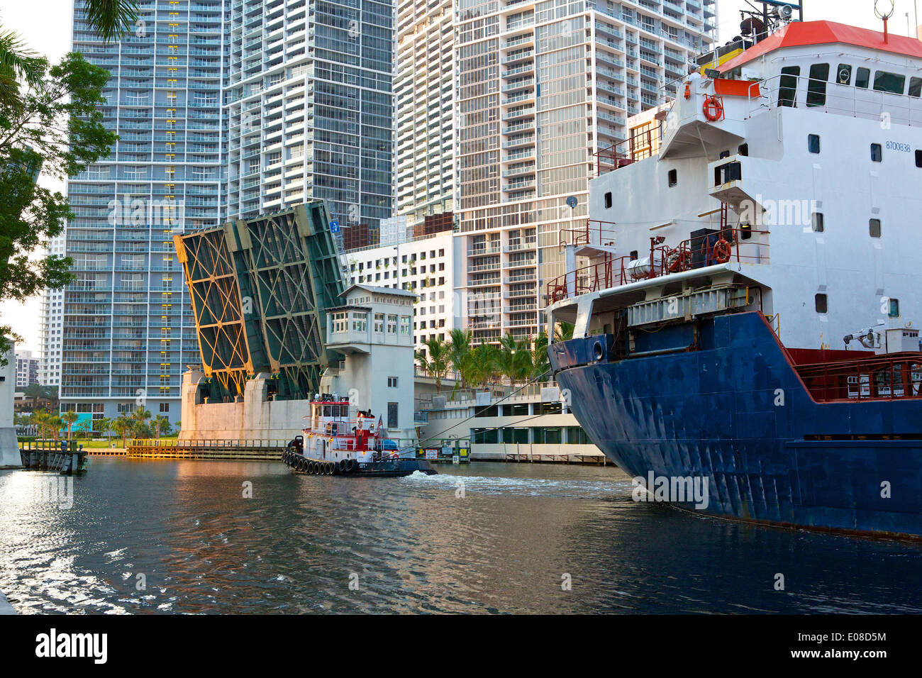 Coastal Cargo Ship Under Tow Along The Miami River, Florida Stock Photo ...