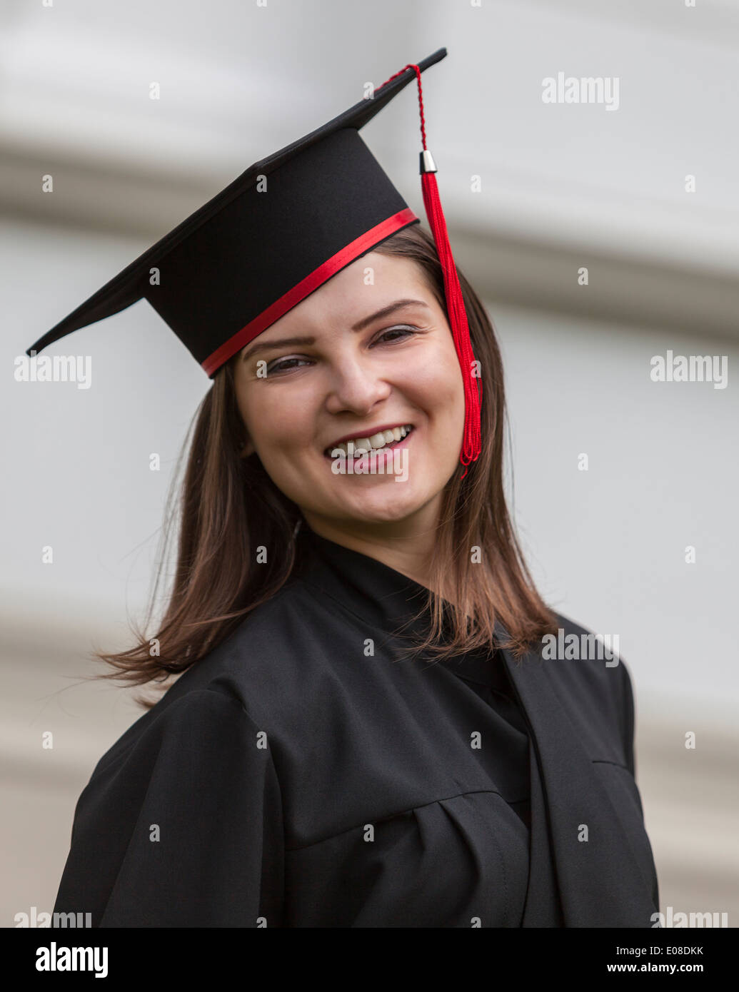 Portrait of a smiling beautiful young woman in the graduation day Stock ...