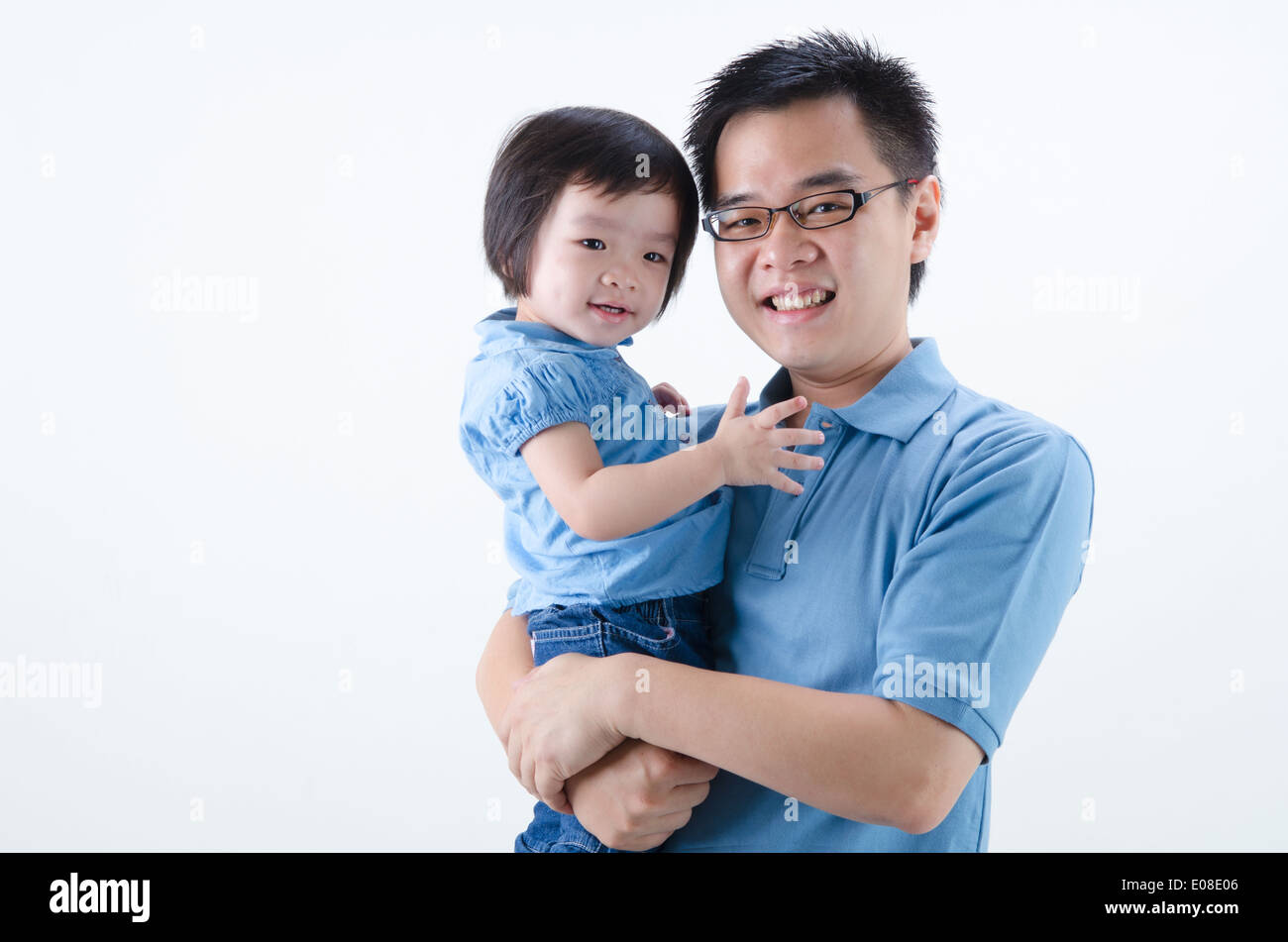 asian father and daughter on plain background Stock Photo - Alamy