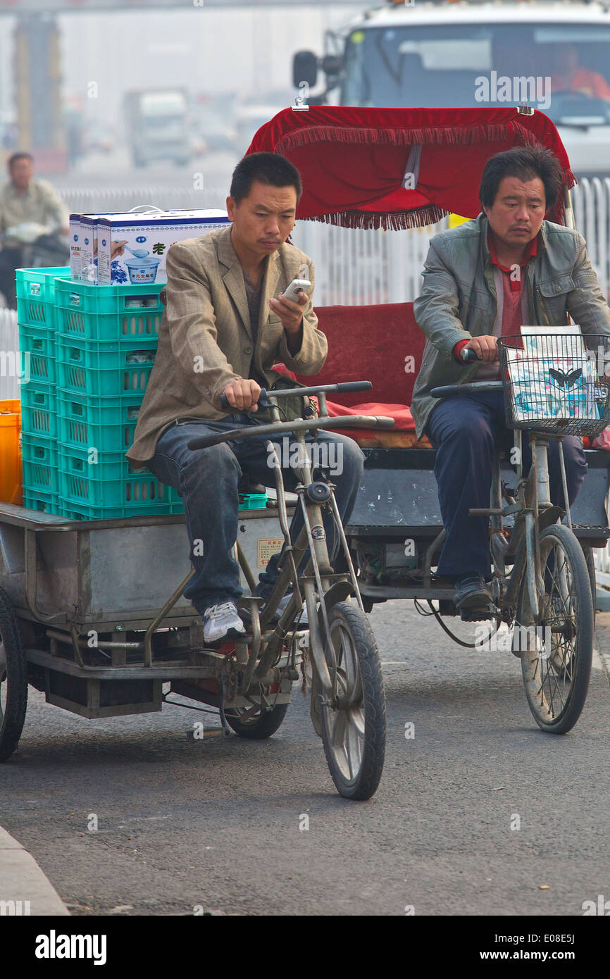 Two Auto Rickshaw Drivers In The Polluted Morning Rush Hour, Beijing ...