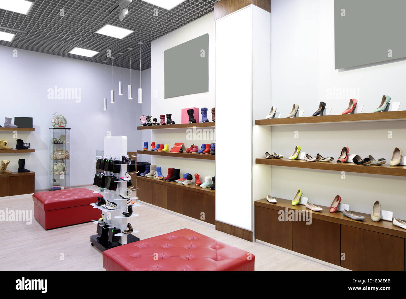 bright and fashionable interior of shoe store in modern mall Stock ...