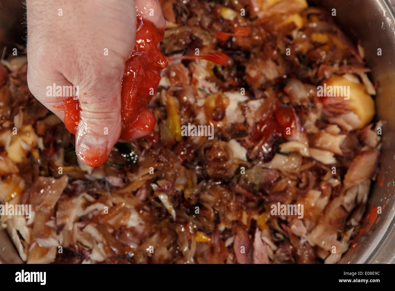 Preparing moked pike, adding mashed tomatoes Stock Photo - Alamy