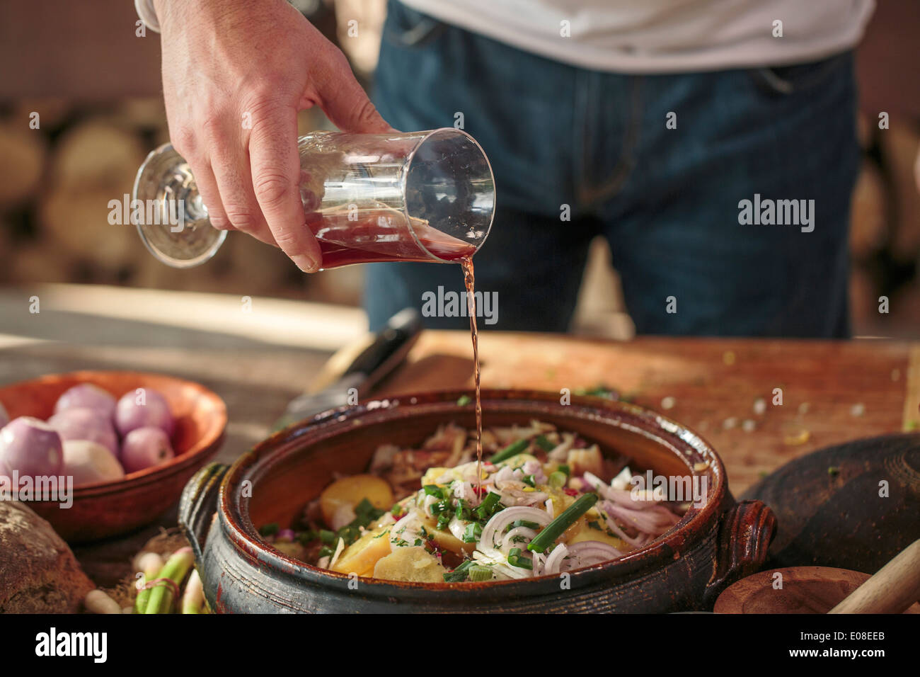 Person preparing potato salad adding sauce Stock Photo - Alamy
