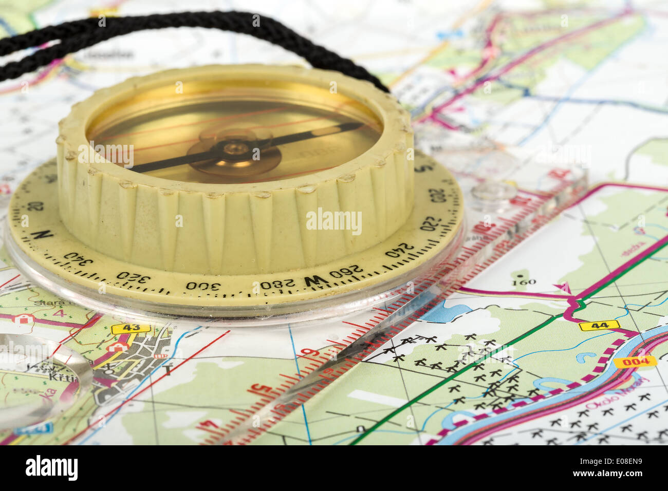 old touristic handheld compass on detailed territory map Stock Photo ...
