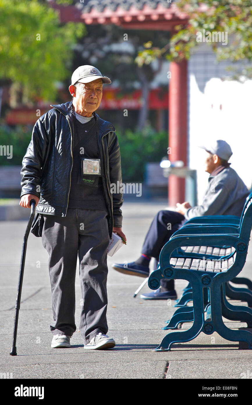 Old chinese man walking stick hi-res stock photography and images - Alamy