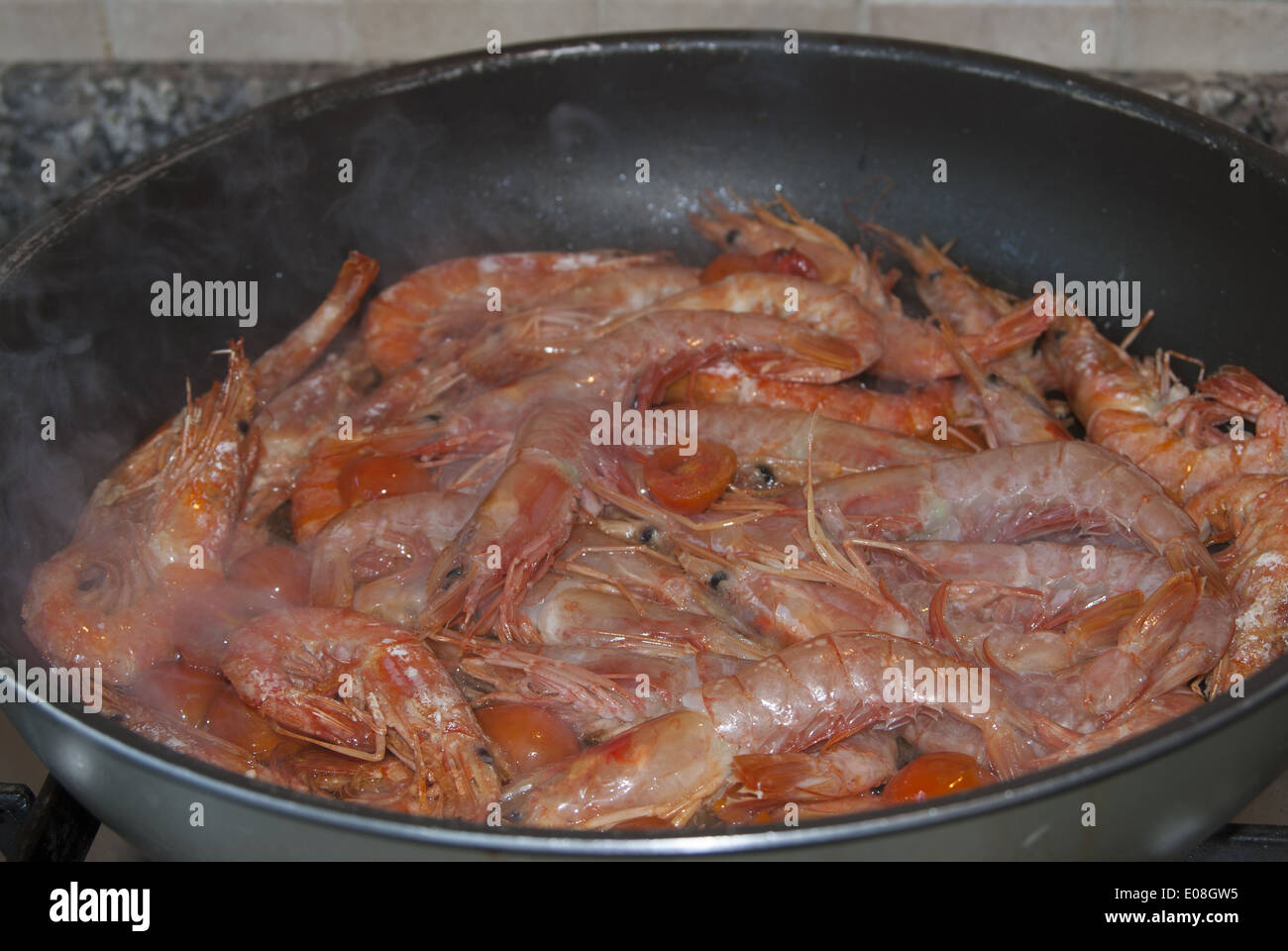 Traditional Italian sea dish: prawns in the pan Stock Photo - Alamy