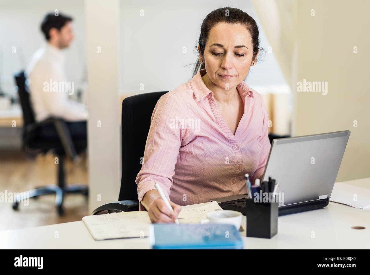 Working at office desk hi-res stock photography and images - Alamy
