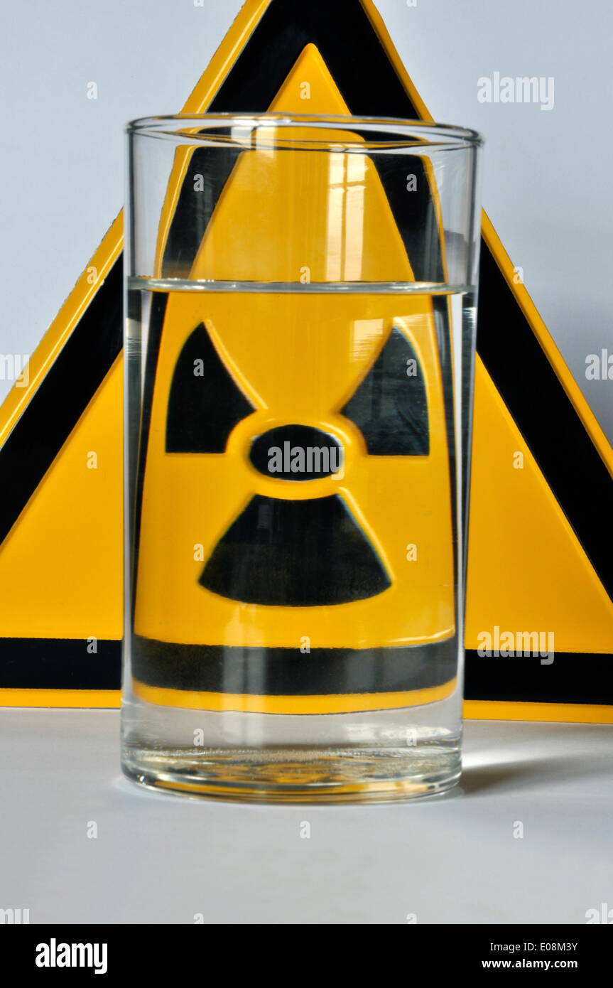 Illustration - A glass of water stands in front of a radioactive ...