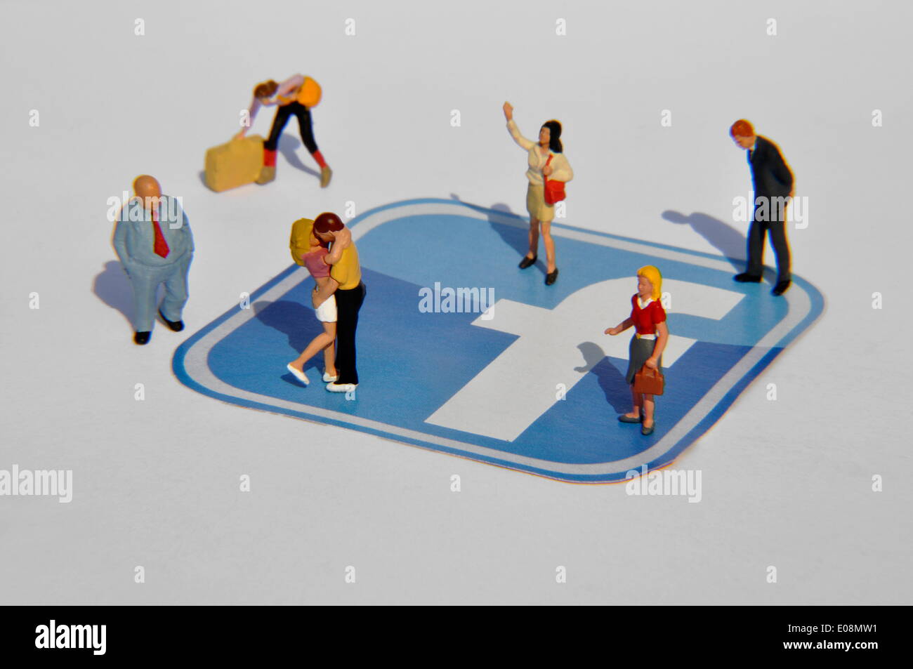 Illustration - Midget figures stand on a facebook logo in Germany, 11 ...