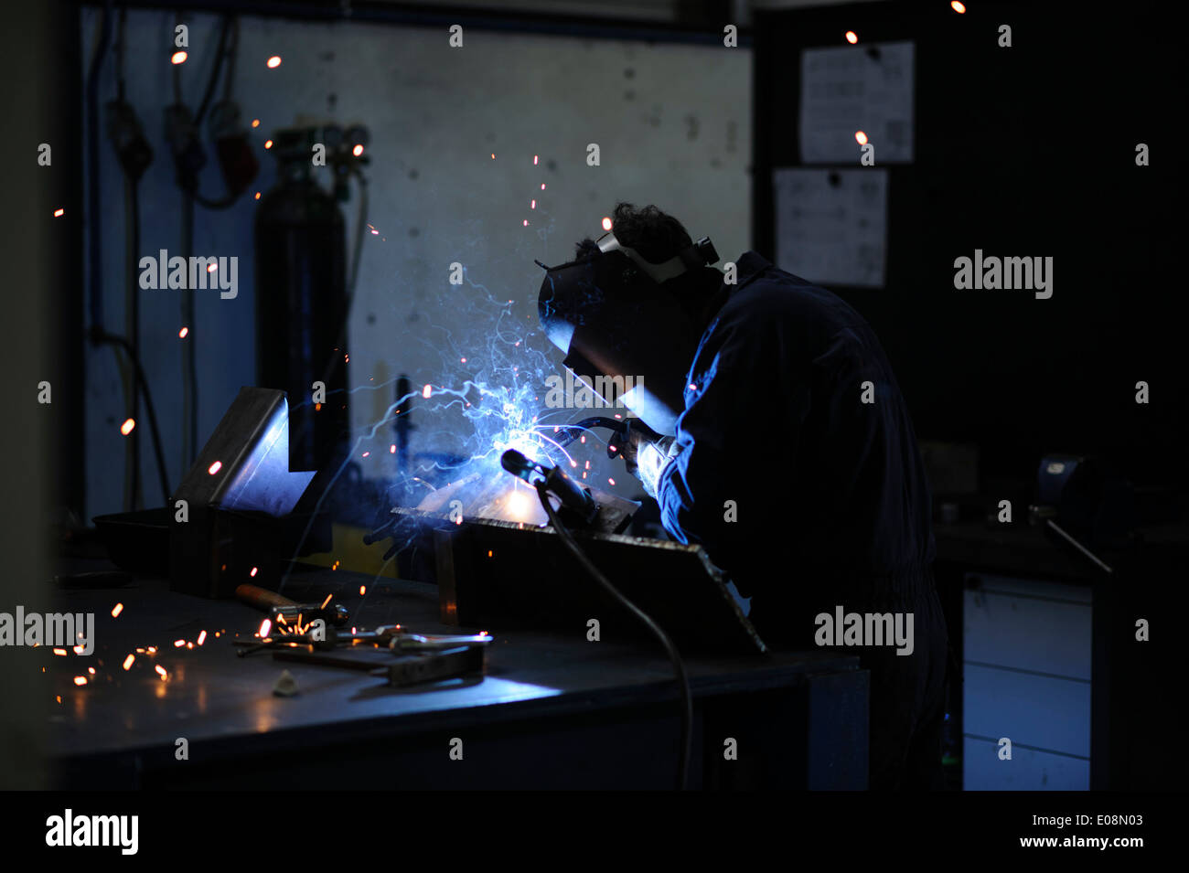 Man welding with safety mask Stock Photo - Alamy