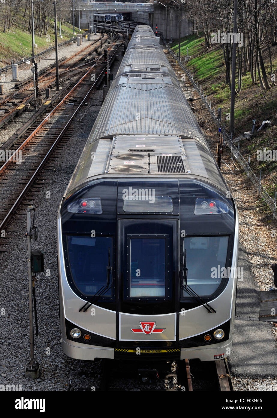 Subway train on tracks outside Stock Photo - Alamy