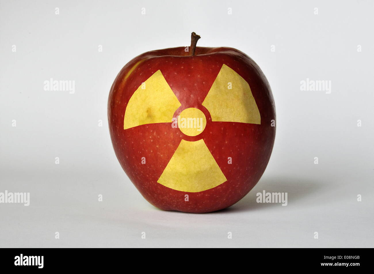 Illustration - A radioactive trefoil symbol on an apple in Germany, 14 ...