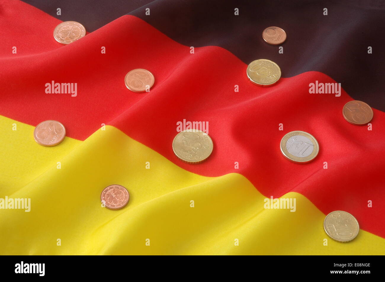 Illustration - Euro coins lie on a German flag in Germany, 10 February ...