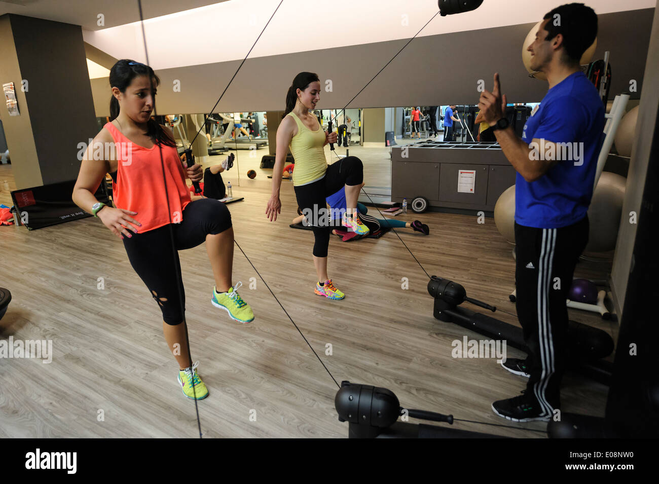 Personal trainer with clients at the gym Stock Photo - Alamy