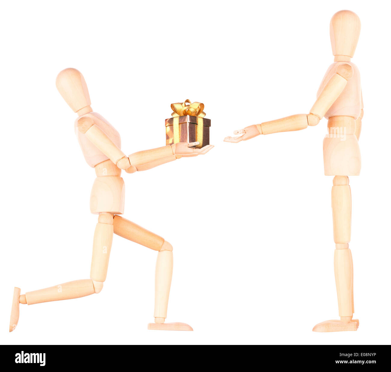 wooden Dummy holding gift with ribbon Isolated Over White Background ...