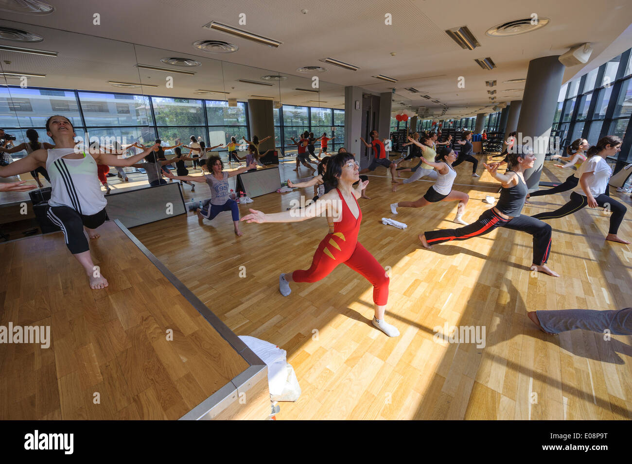 People stretching during Yoga fitness class at the gym Stock Photo - Alamy