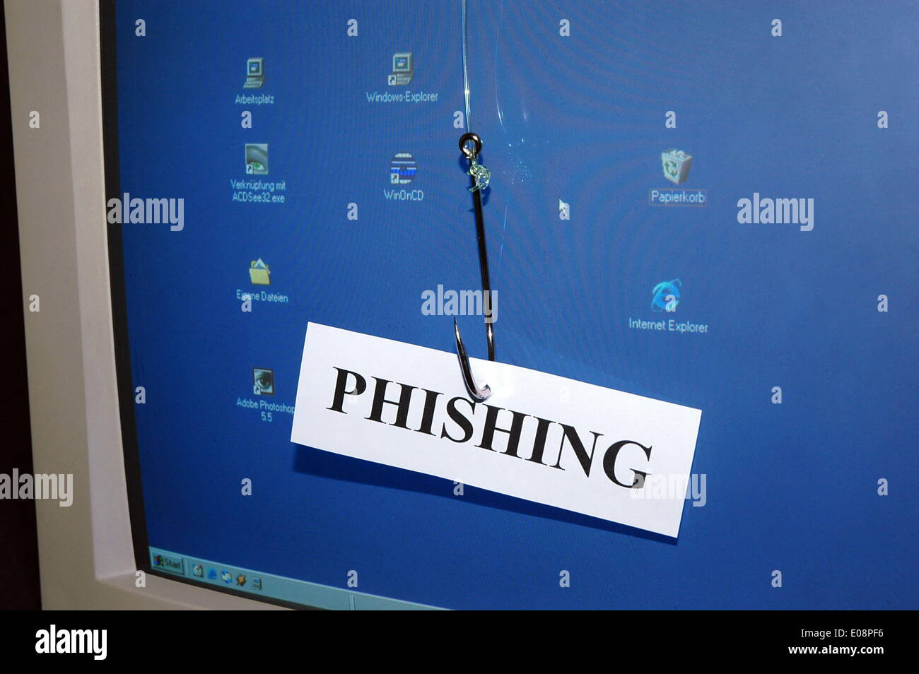 Illustration - A sign reading 'Phishing' hangs on a fish hook in front ...