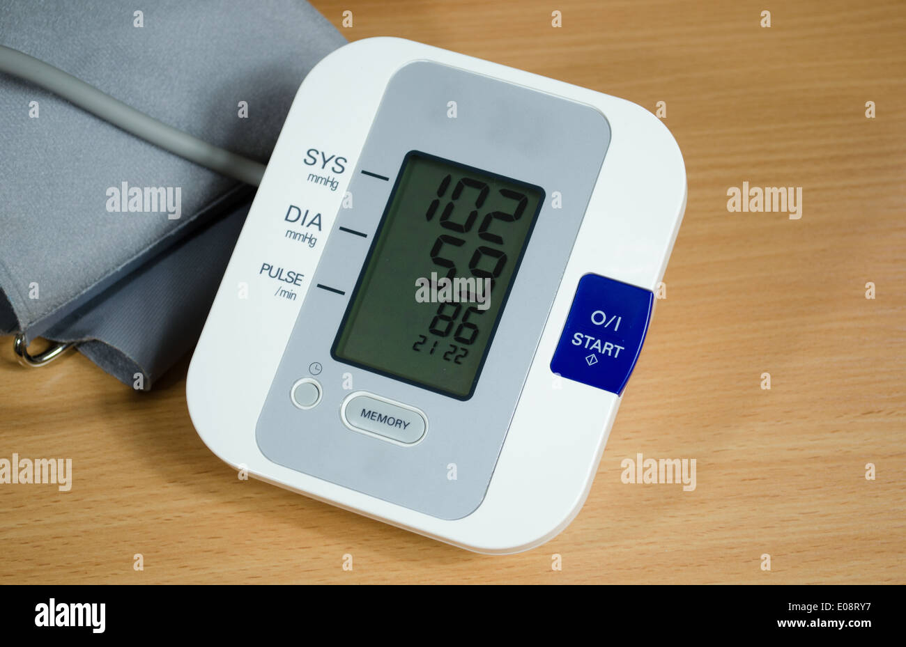 digital blood pressure measurement equipment on table Stock Photo - Alamy