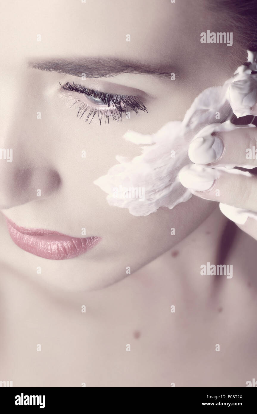 Female beauty model with moisturiser on face Stock Photo - Alamy