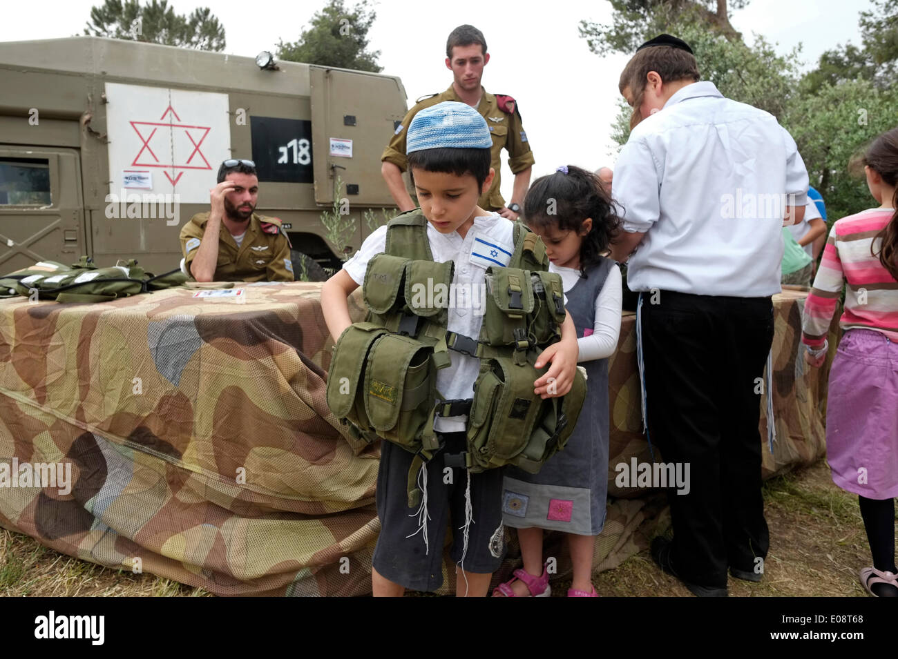 An Israeli child wearing a tactical vest during an exhibition of ...