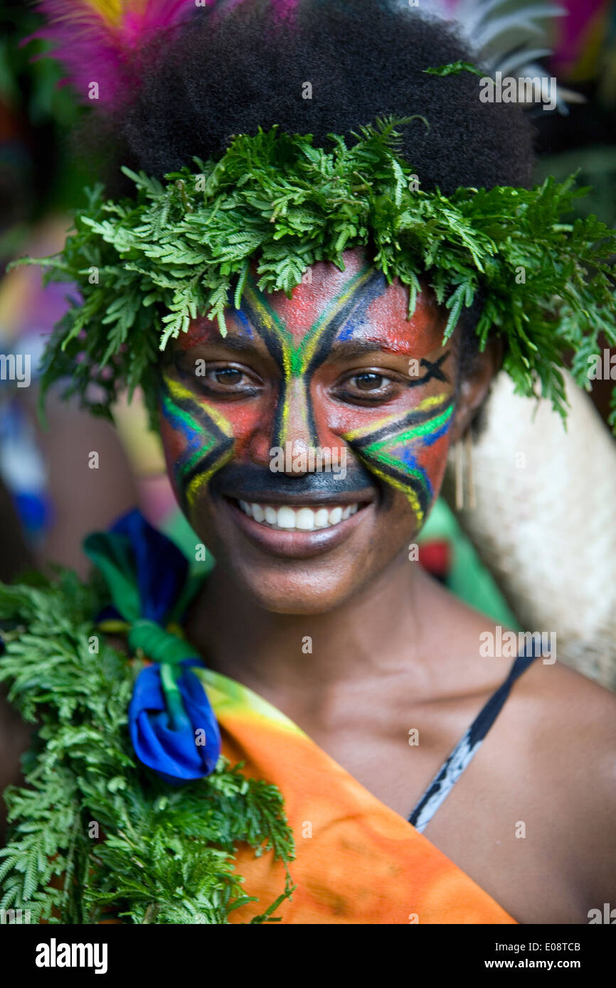 Decked out in traditional costumes and body paint, members of a ladies ...