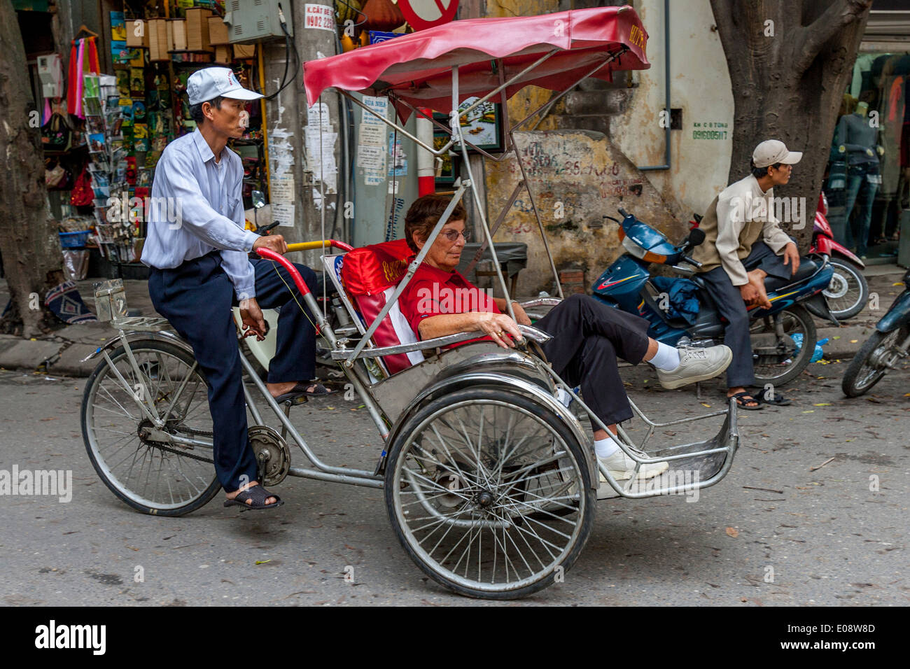 A Tourist Taking A Ride In A Cycle Rickshaw, Hanoi, Vietnam Stock Photo ...