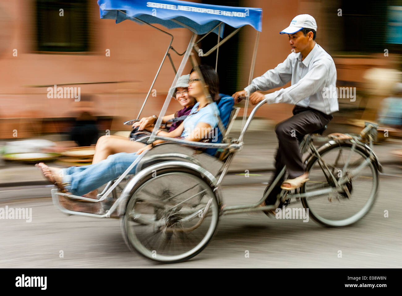 Tourist Take A Ride In A Cycle Rickshaw, Hanoi, Vietnam Stock Photo - Alamy