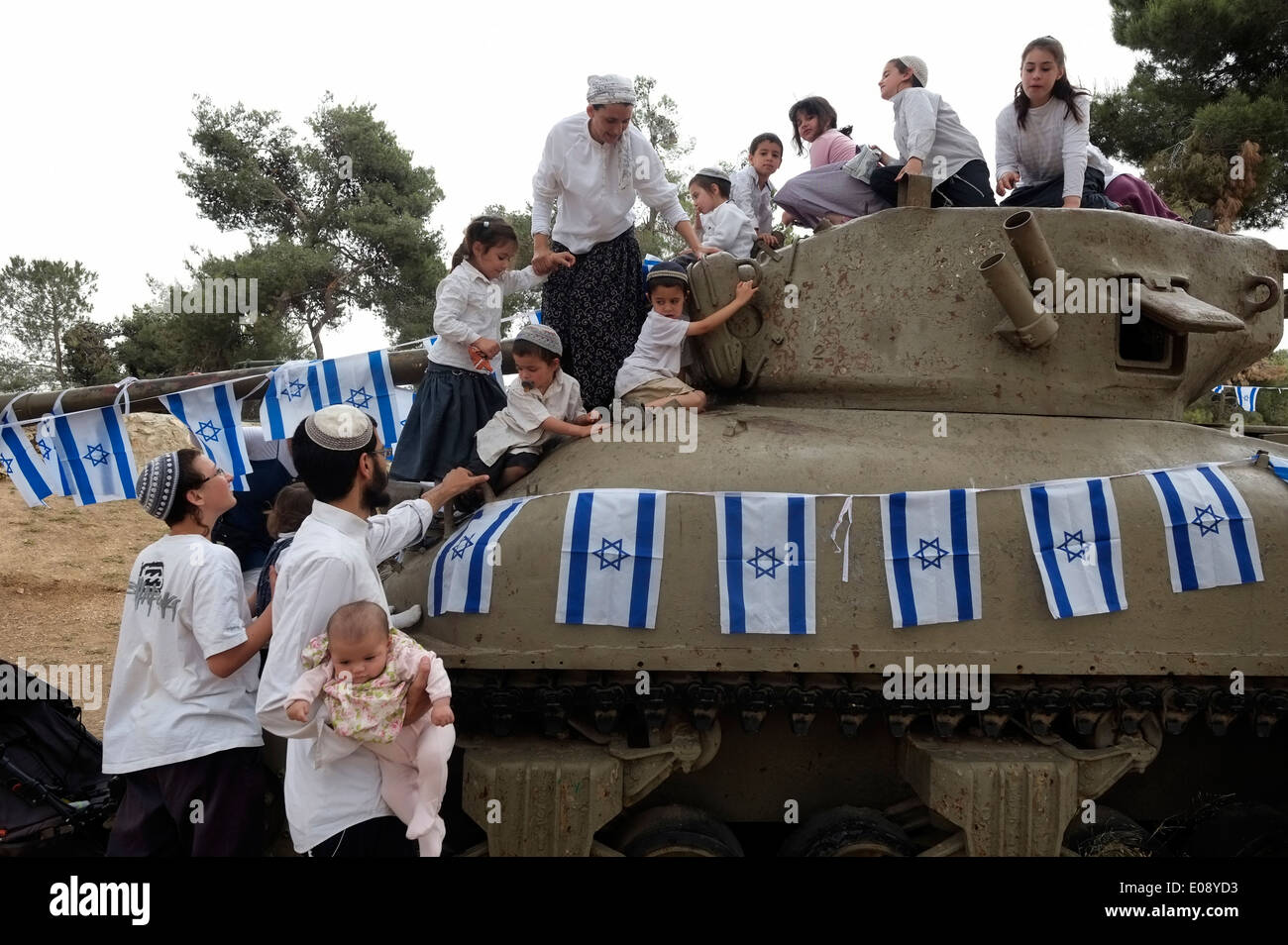 Children playing on an old military tank in Ammunition Hill during 66th ...