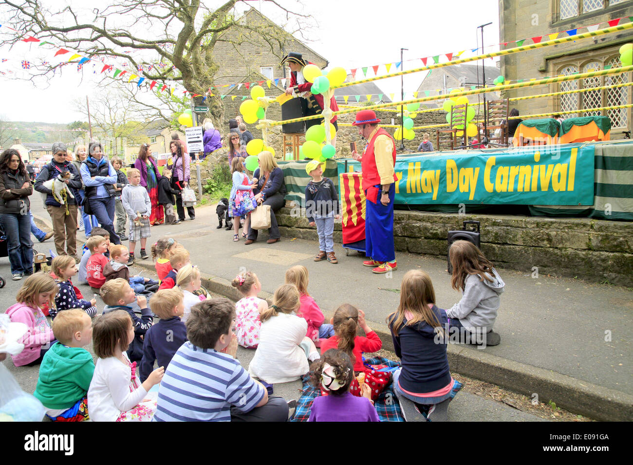 Children enjoying a magic entertainer at the Ashover Carnival ...