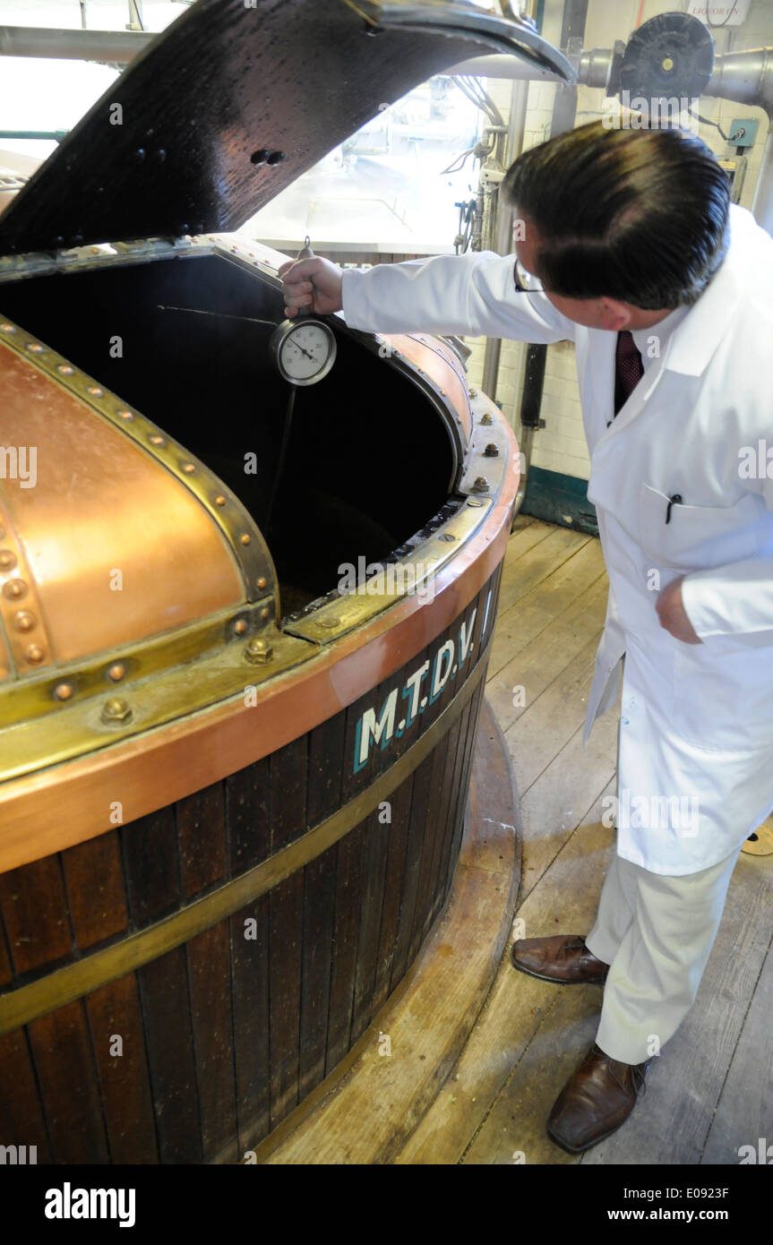 Head Brewer inspecting the Copper Still at Harveys Brewery, Lewes ...