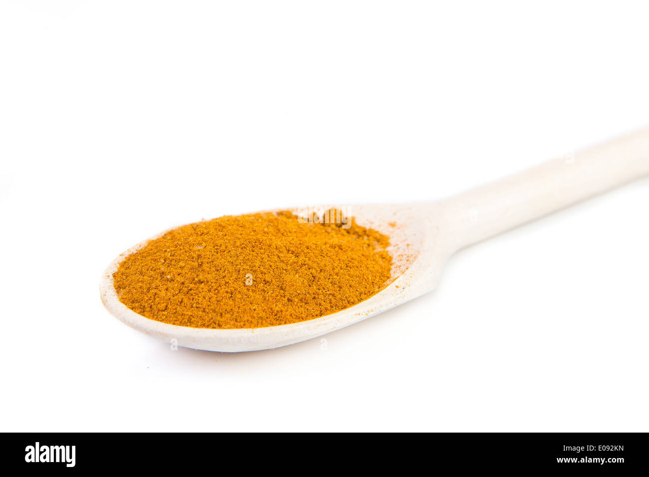 curry on a spoon on white background Stock Photo - Alamy