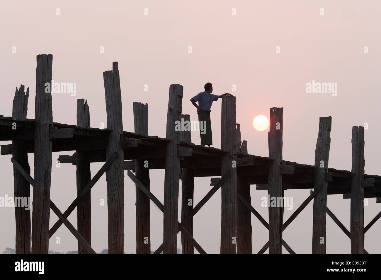 Burma Myanmar U Bein Bridge sunrise sunset man standing on bridge at ...