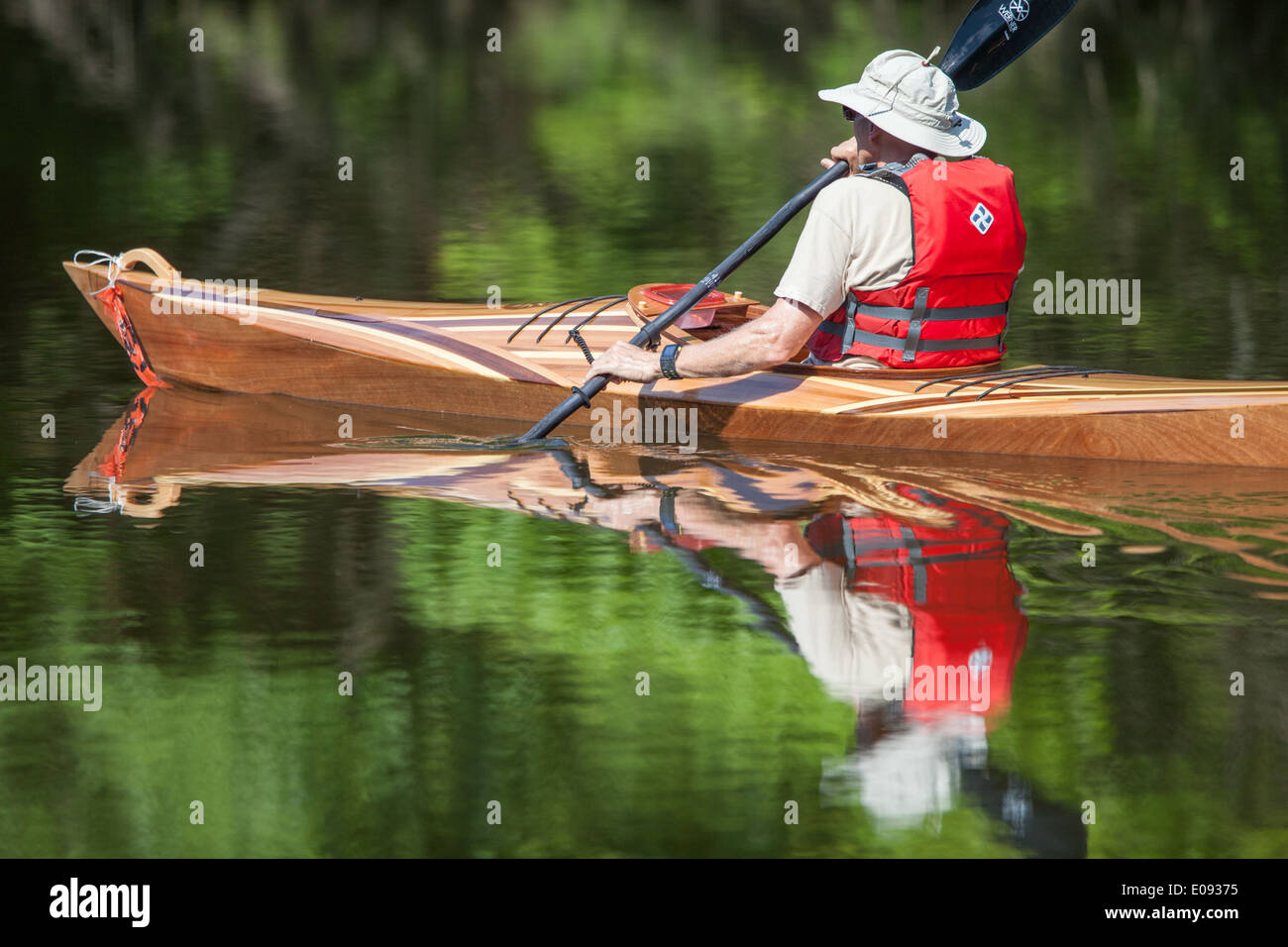 Hand made wood canoe. Reflection in water. Colorful. Horizontal Stock ...
