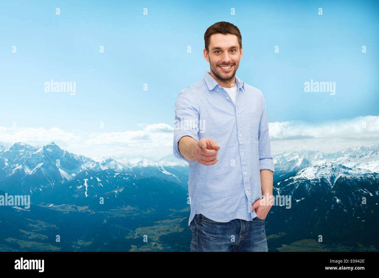 smiling man pointing finger at you Stock Photo - Alamy
