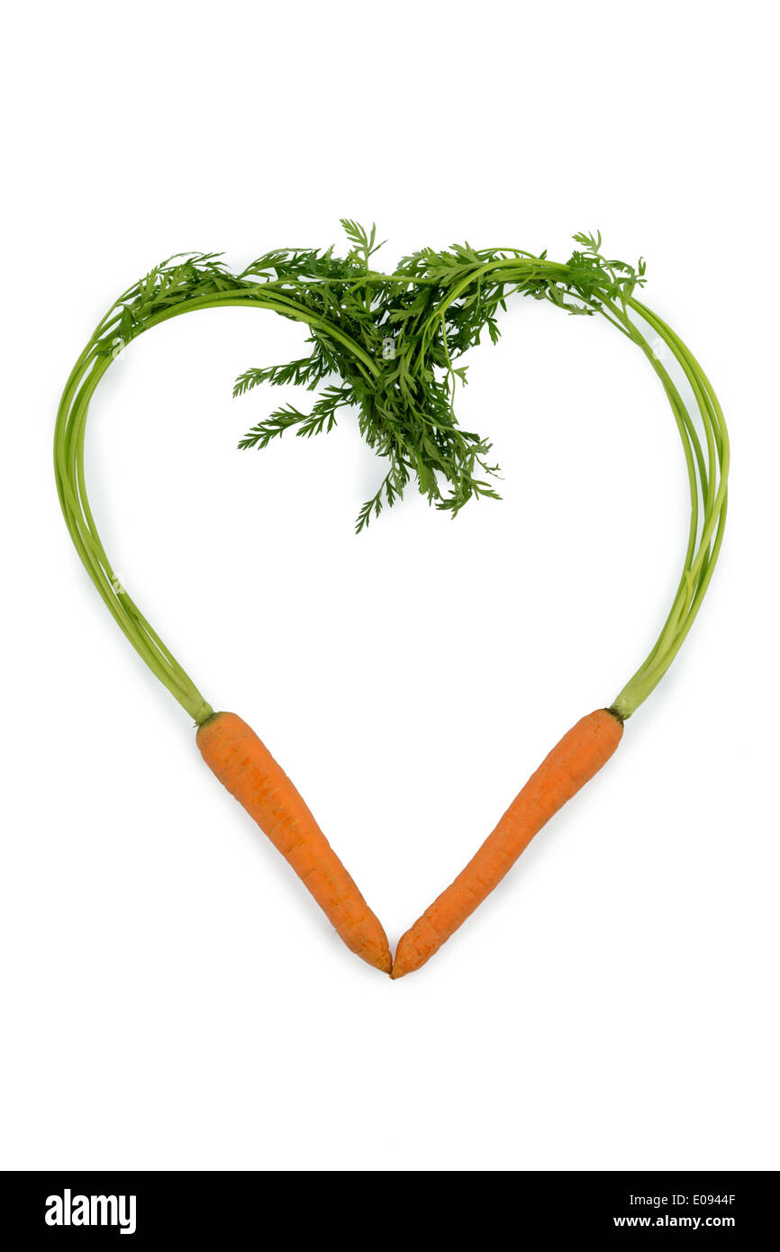 A heart from carrots from biological cultivation. Fresh fruit and ...