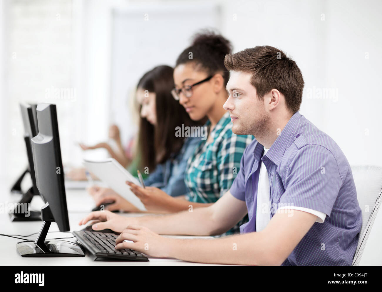 students with computers studying at school Stock Photo - Alamy